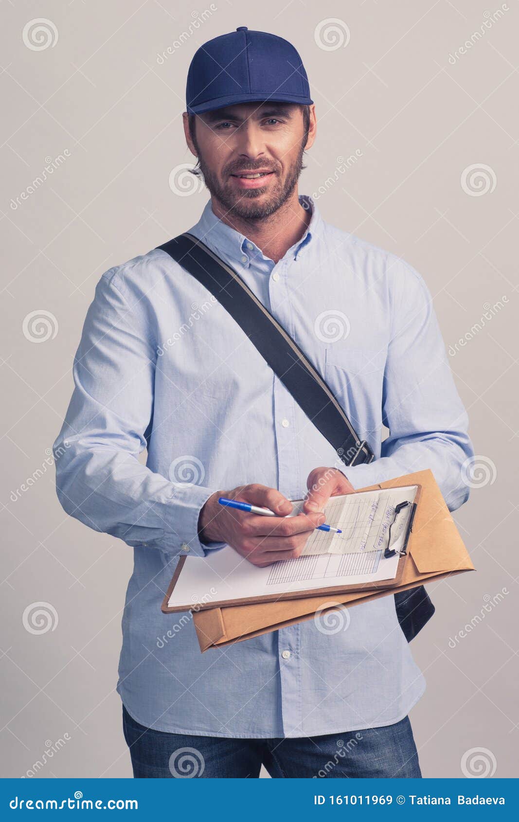 Delivery man holding form stock image. Image of clipboard - 161011969