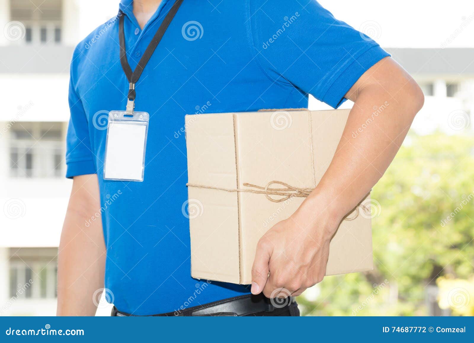 Delivery Man Holding a Parcel Box. Delivery Service Concept Stock Photo ...