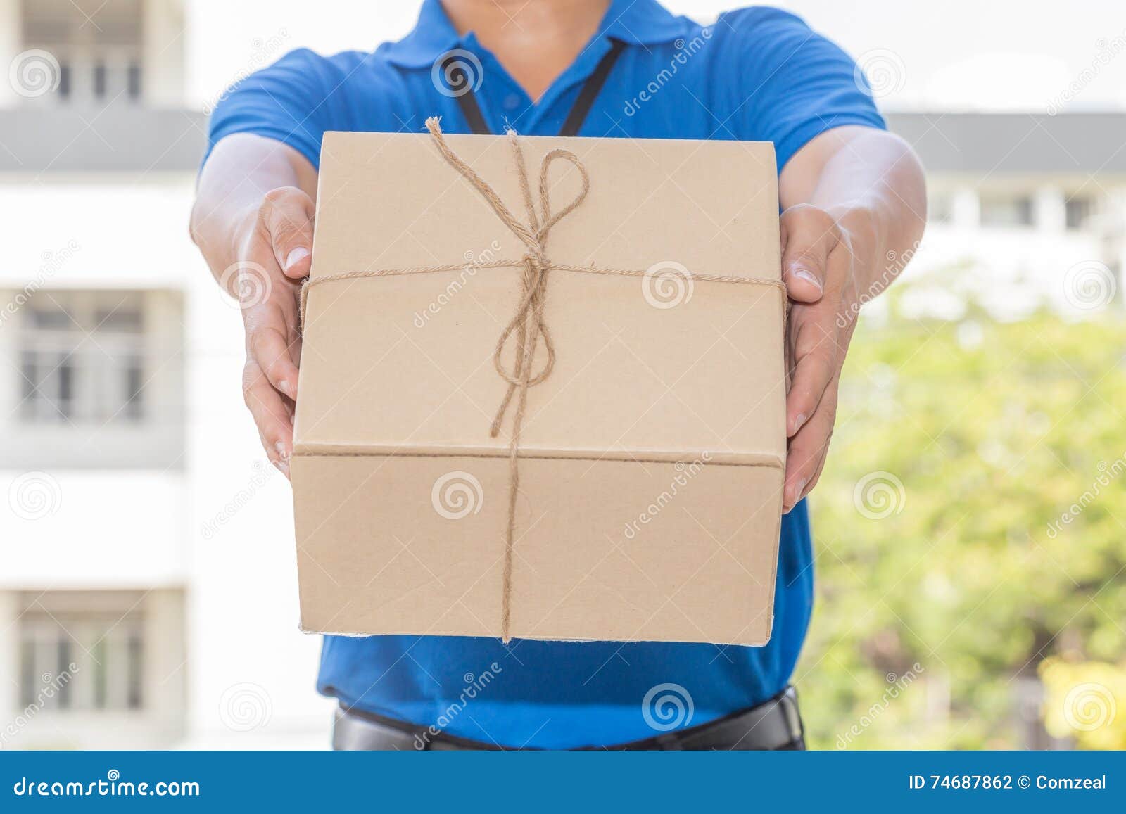 Delivery Man Holding a Parcel Box. Delivery Service Concept Stock Photo ...