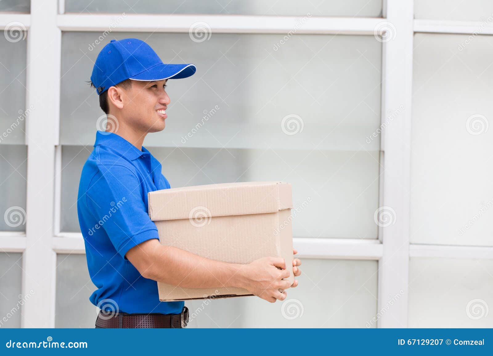 Delivery Man Holding a Parcel Box Stock Image - Image of mail ...