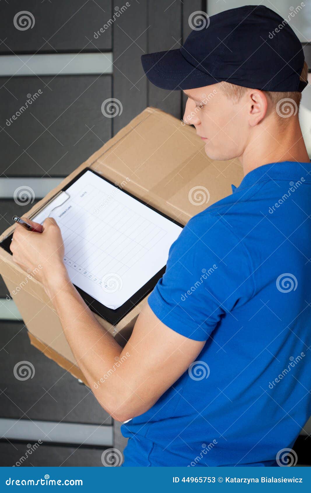 Delivery Man Holding a Parcel Stock Image - Image of front, mail: 44965753