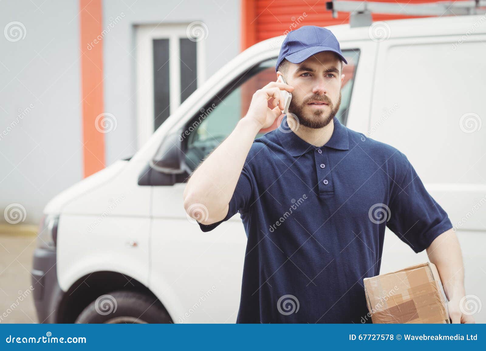 Delivery Man Making a Phone Call Stock Photo - Image of delivery ...