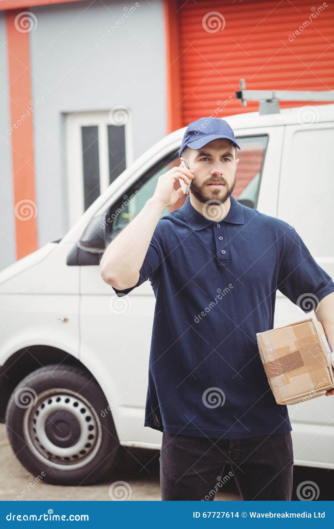 Delivery Man Making a Phone Call Stock Photo - Image of delivery ...