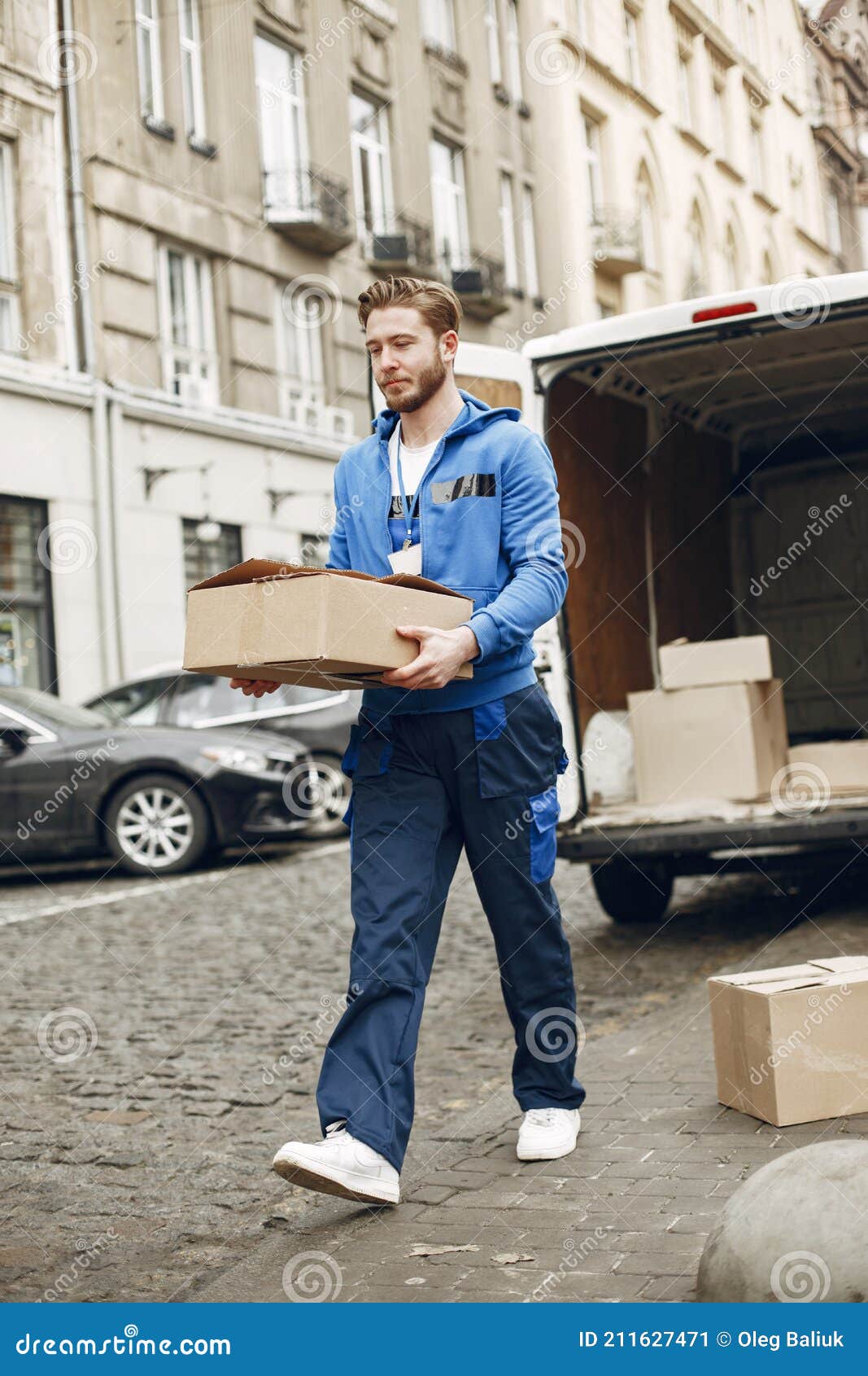 Delivery Man with Package Outdoors Stock Image - Image of industry ...