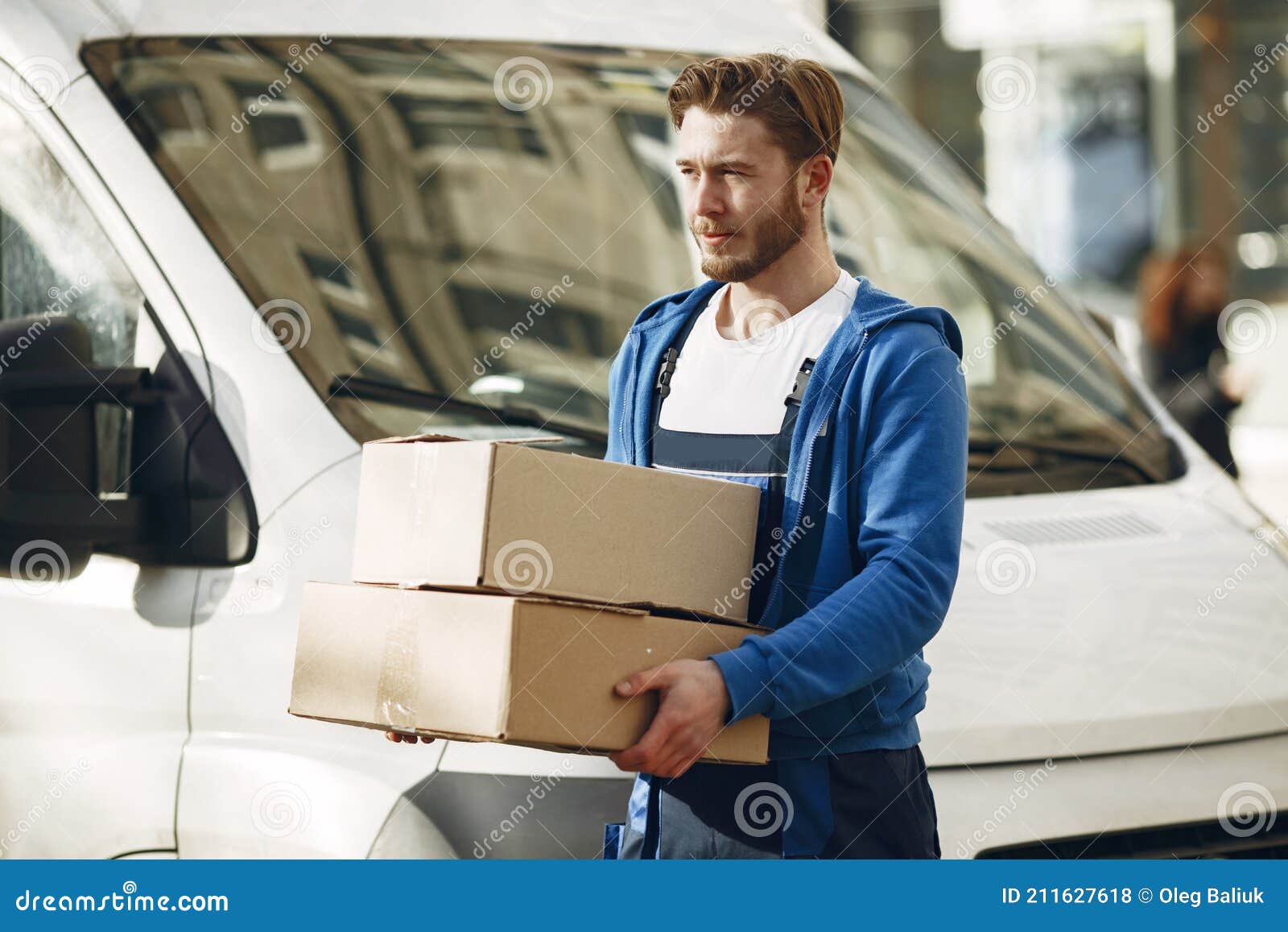 Delivery Man with Package Outdoors Stock Photo - Image of outdoors ...