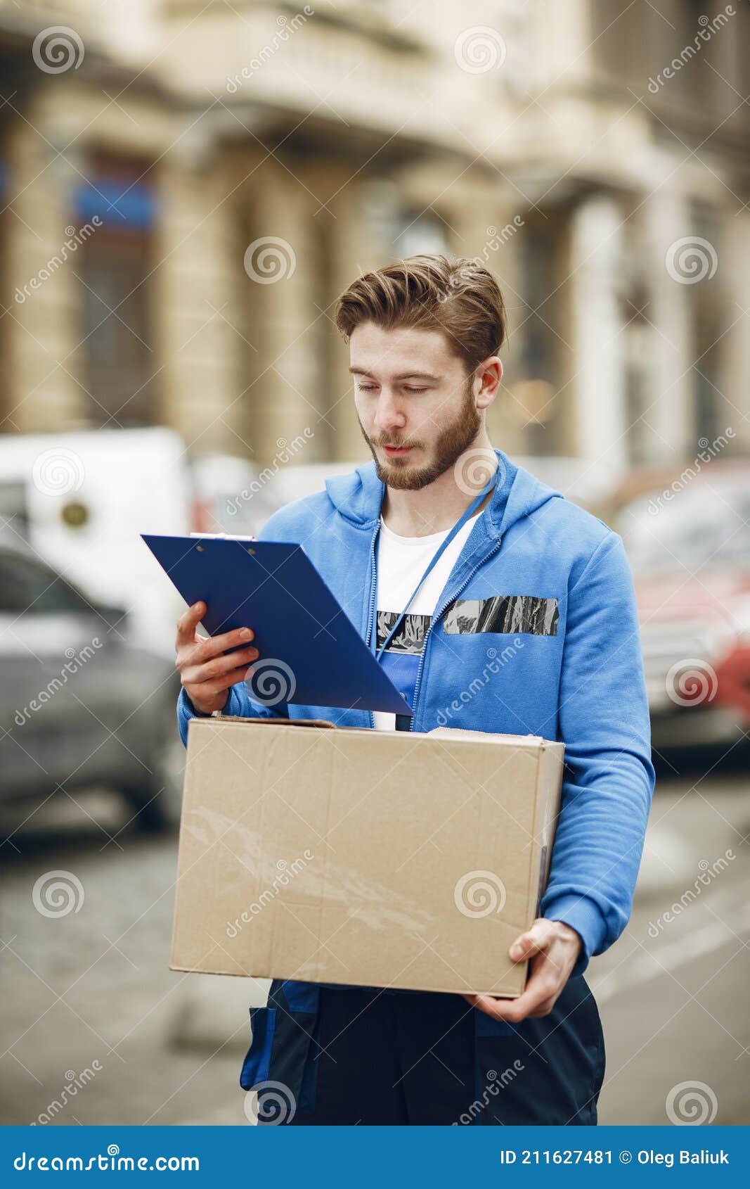 Delivery Man with Package Outdoors Stock Image - Image of ...