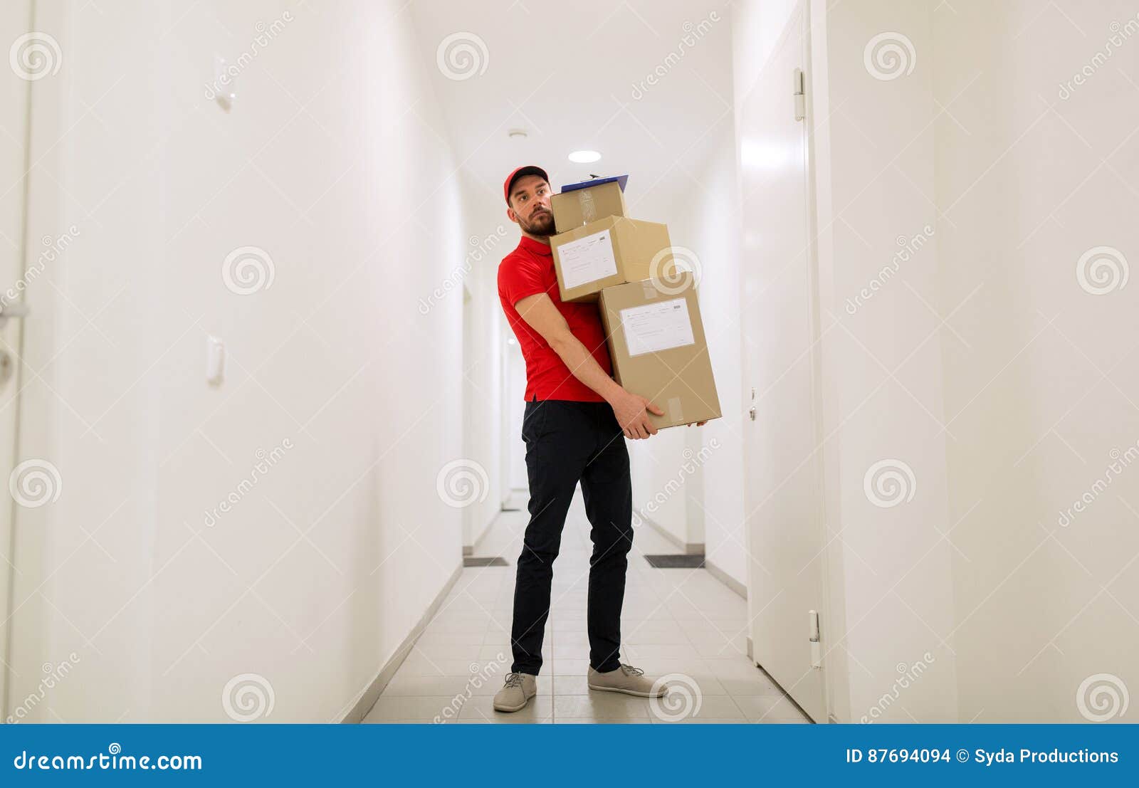 Delivery Man with Parcel Boxes in Corridor Stock Photo - Image of mail ...