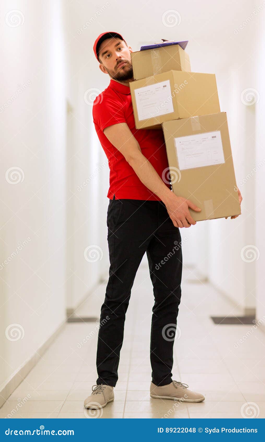 Delivery Man with Parcel Boxes in Corridor Stock Photo - Image of ...