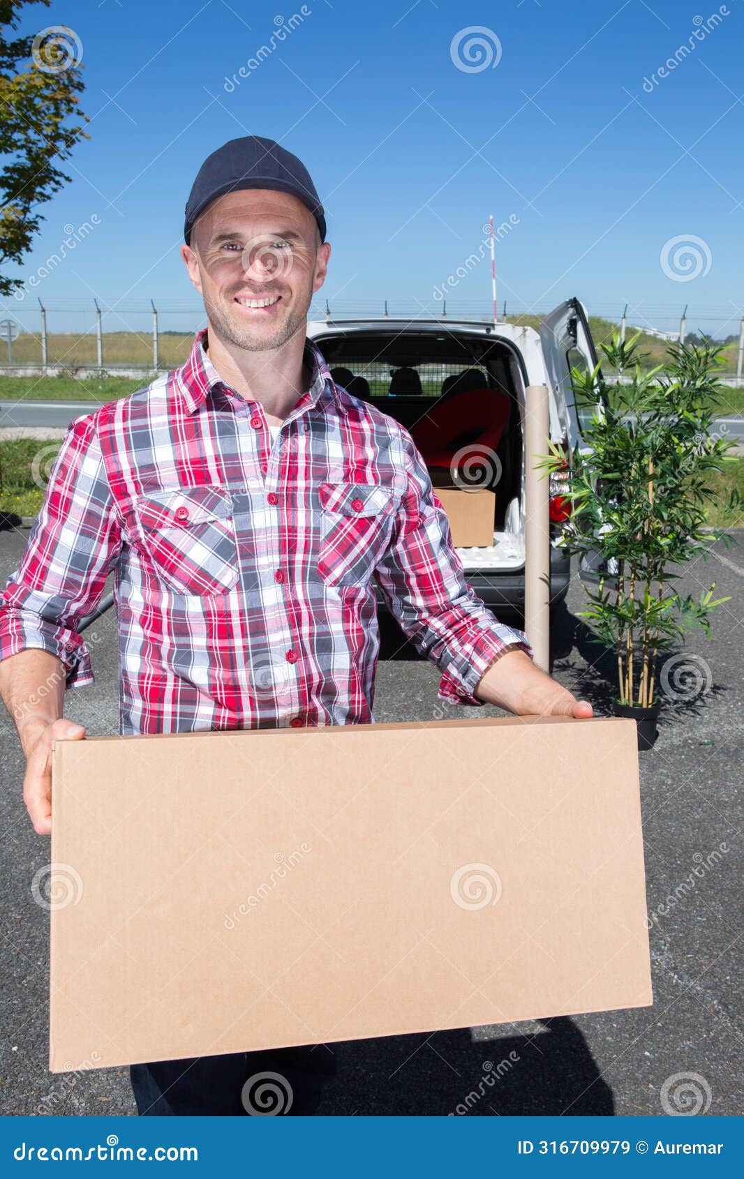 Delivery Man with Parcel Waiting at Front Door Stock Image - Image of ...