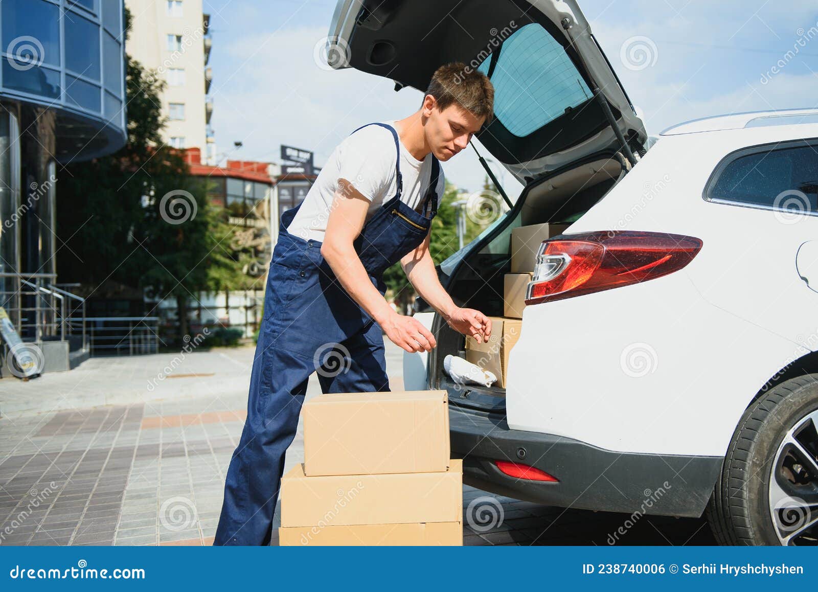 Delivery Man Picking Up Box from Car Stock Photo - Image of order, face ...