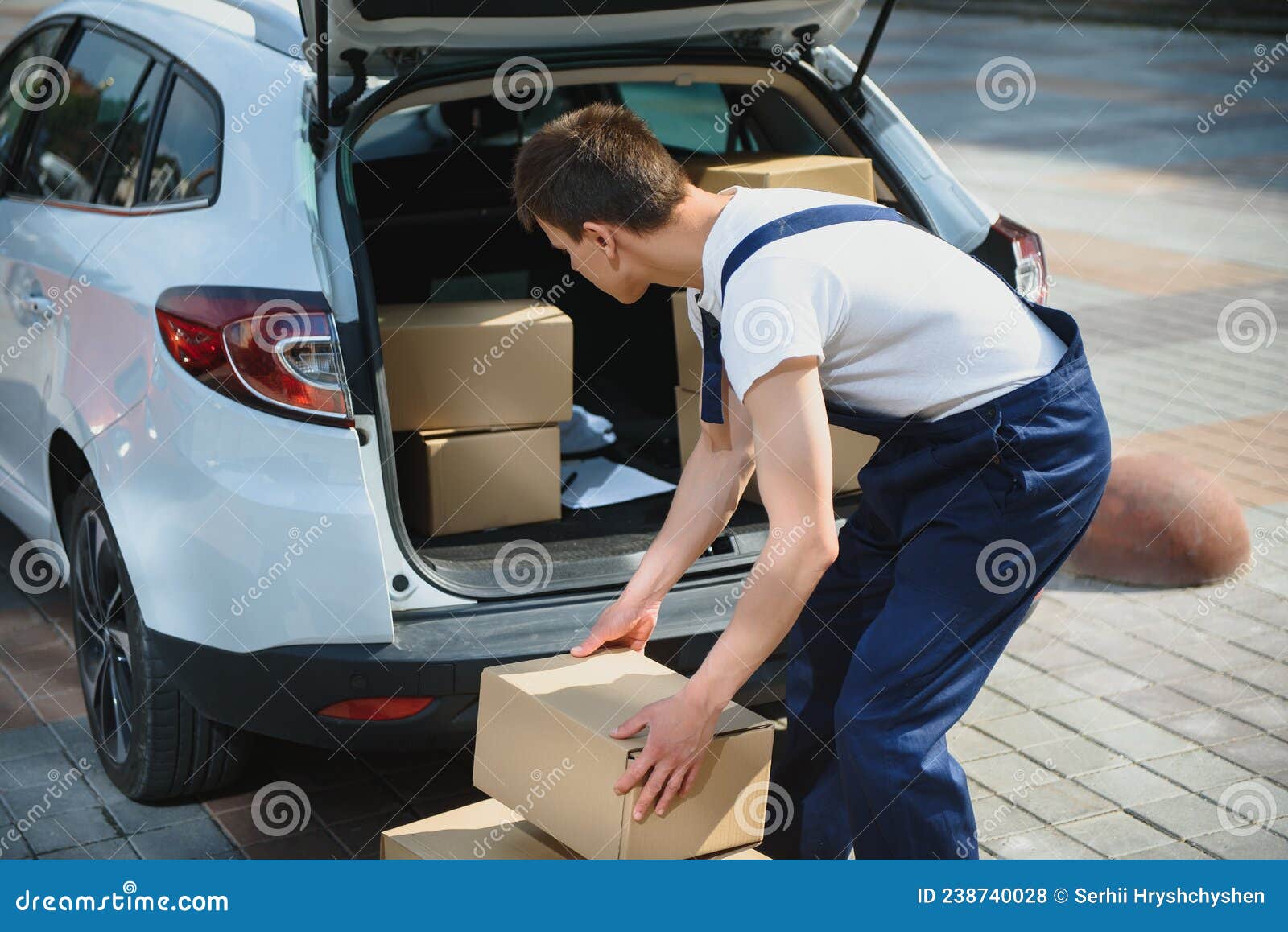 Delivery Man Picking Up Box from Car Stock Photo - Image of happy ...