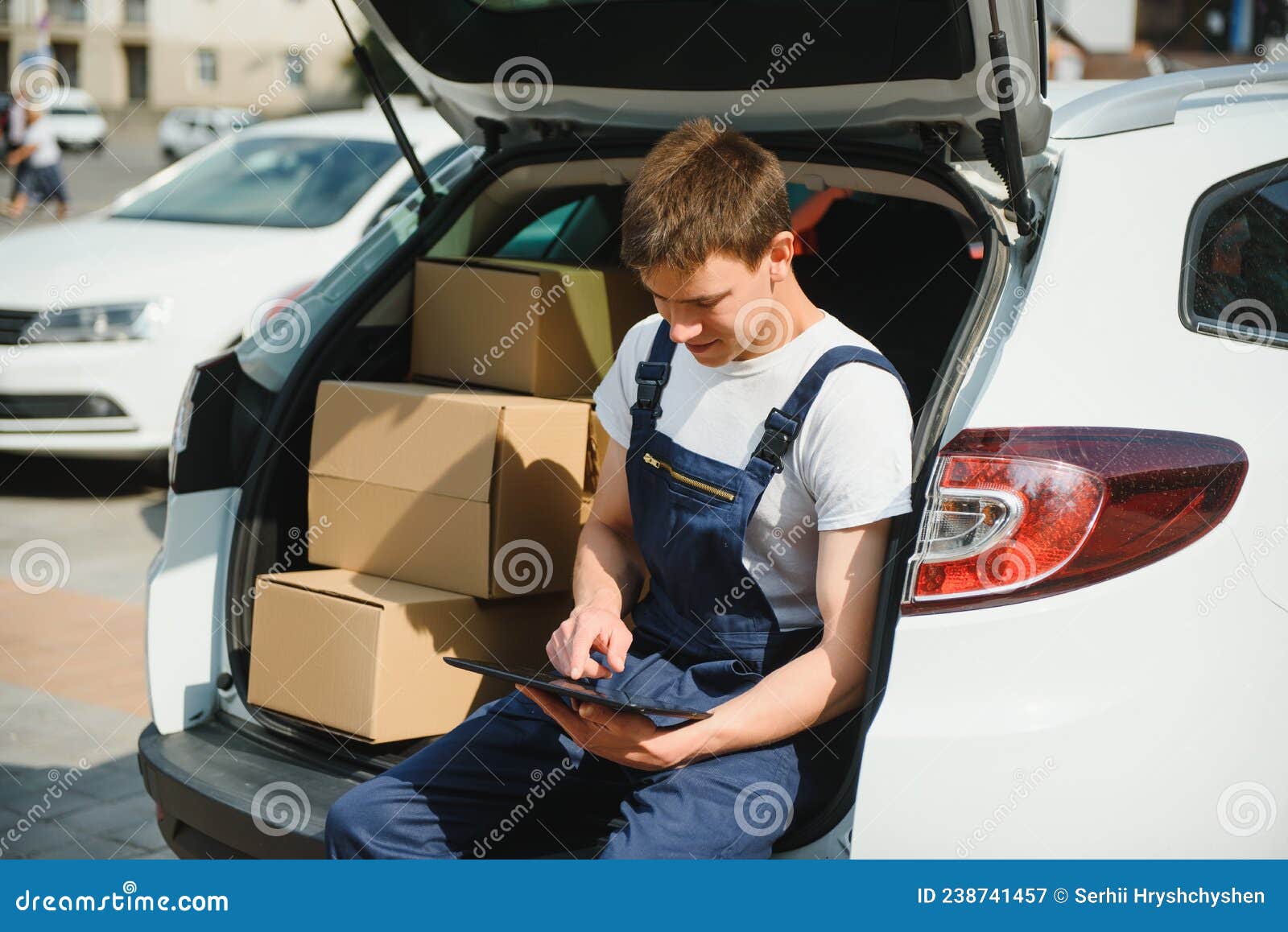 Delivery Man Picking Up Box from Car Stock Image - Image of ...
