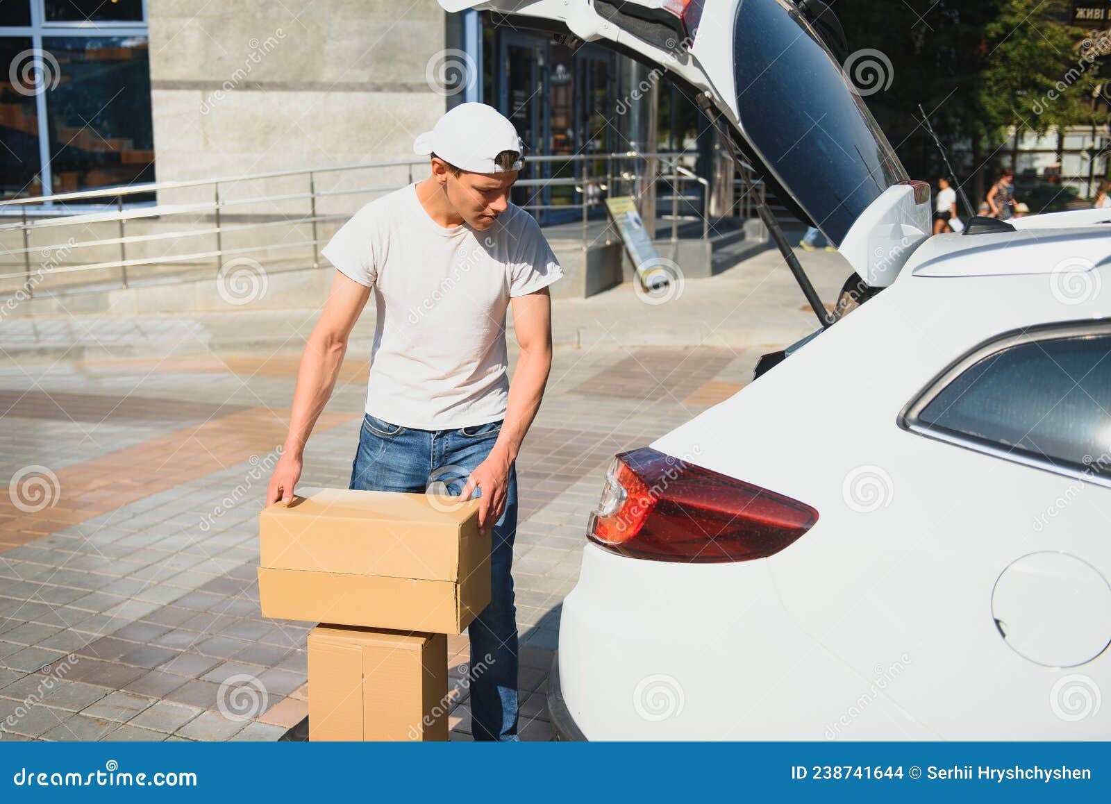 Delivery Man Picking Up Box from Car Stock Photo - Image of delivery ...