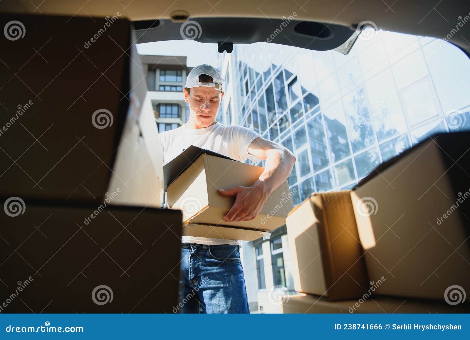 Delivery Man Picking Up Box from Car Stock Photo - Image of doctor ...