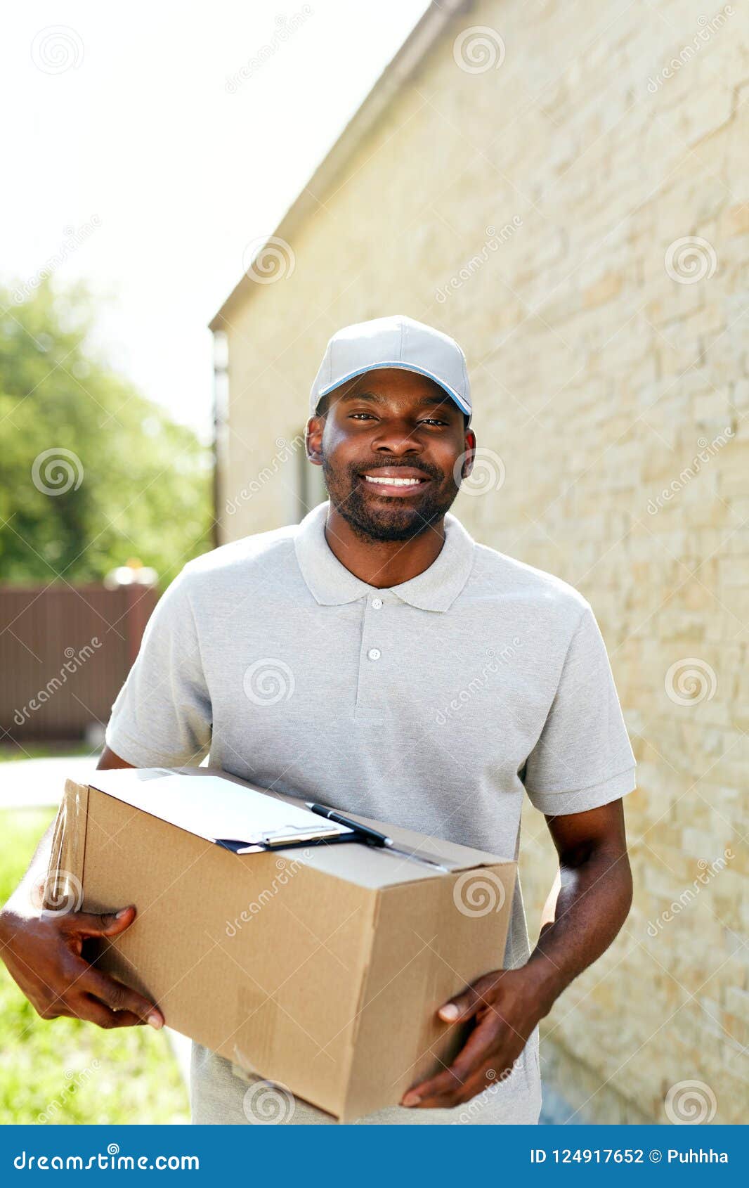Delivery Man. Portrait of Smiling Courier with Box Package Stock Photo ...