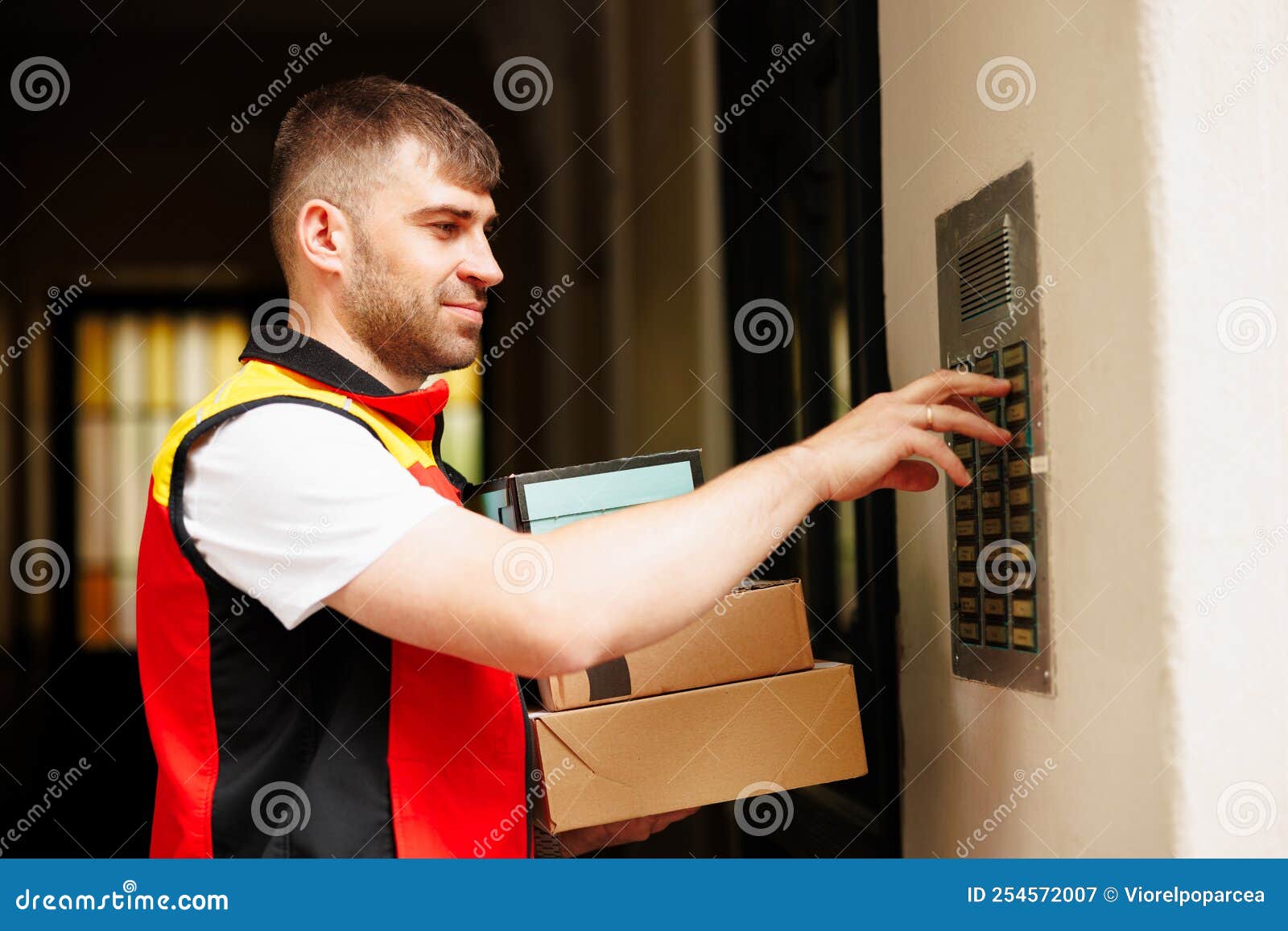 Delivery Man Pressing Button of Intercom Down the Street Stock Image ...
