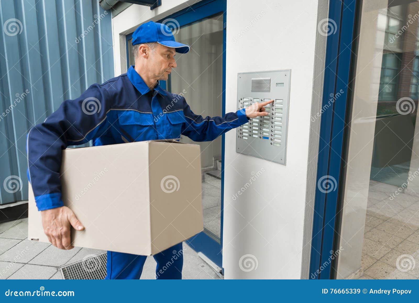 Delivery Man Pressing Button of Intercom To Enter Building Stock Image ...