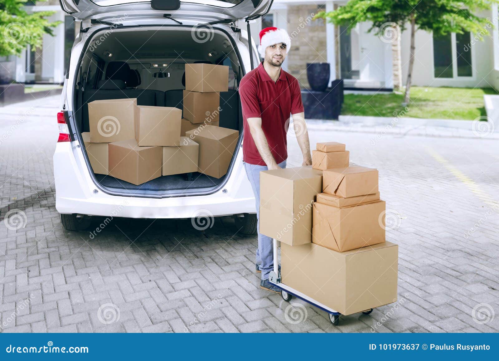 Delivery Man Pushing a Stack of Package Stock Image - Image of ...