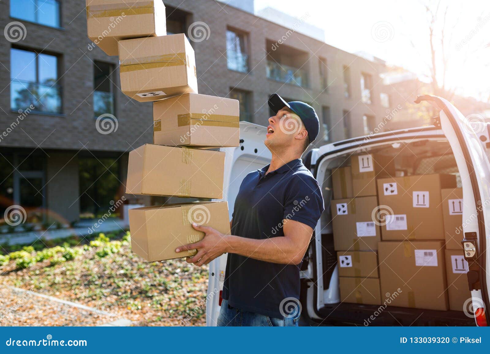 Delivery Man Dropping Boxes Stock Photo - Image of employee, mover ...