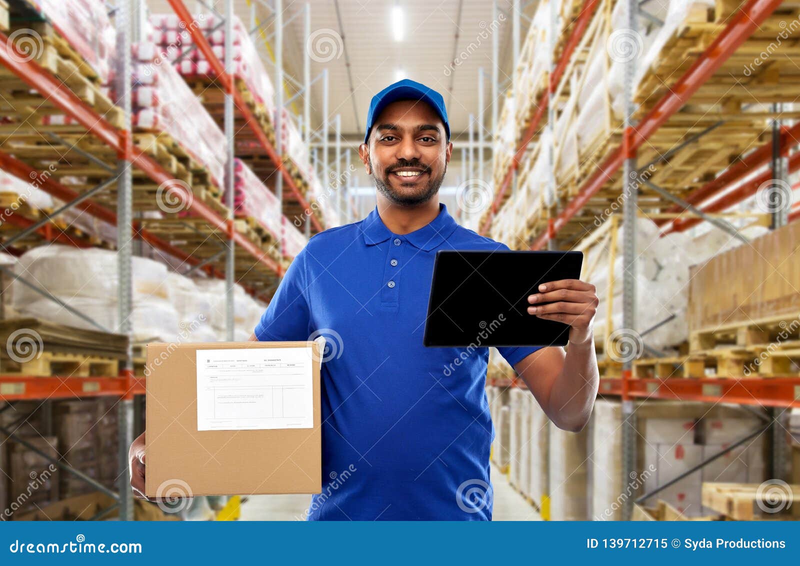 Delivery Man with Tablet Pc and Box at Warehouse Stock Image - Image of ...