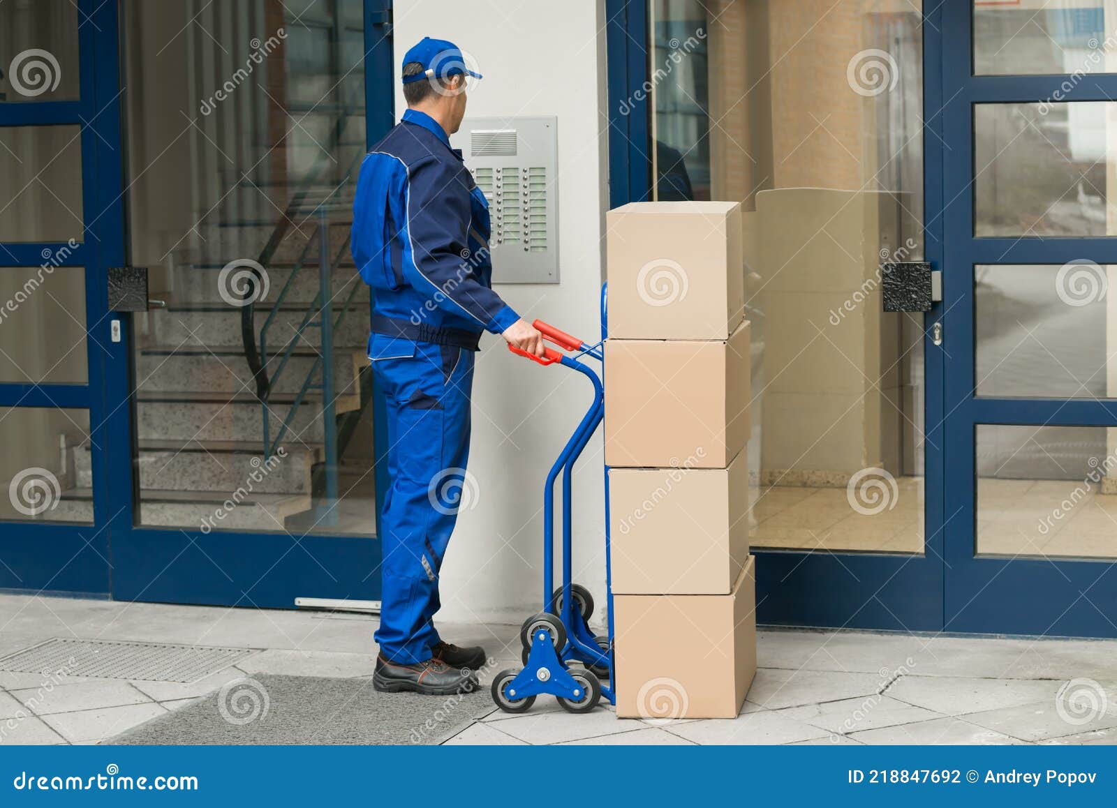 Delivery Man with Trolley Using Security To Enter Building Stock Photo ...