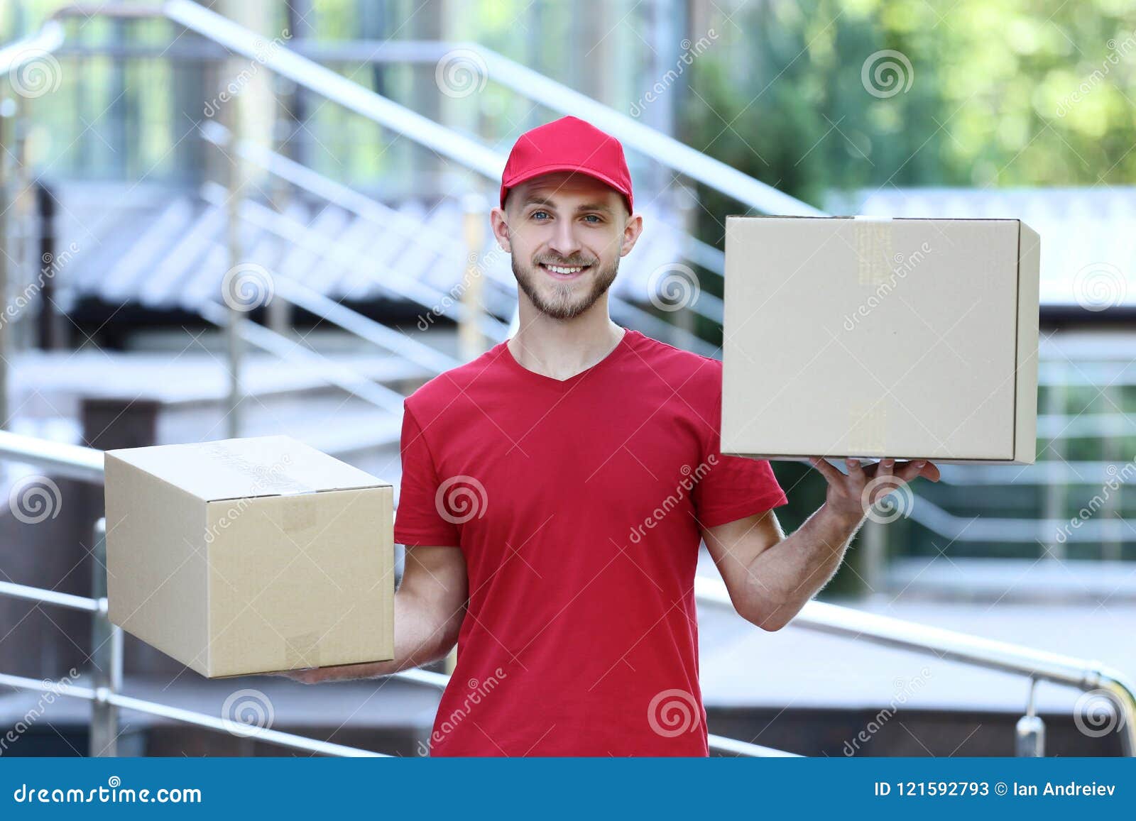 Delivery man in uniform stock image. Image of postman - 121592793
