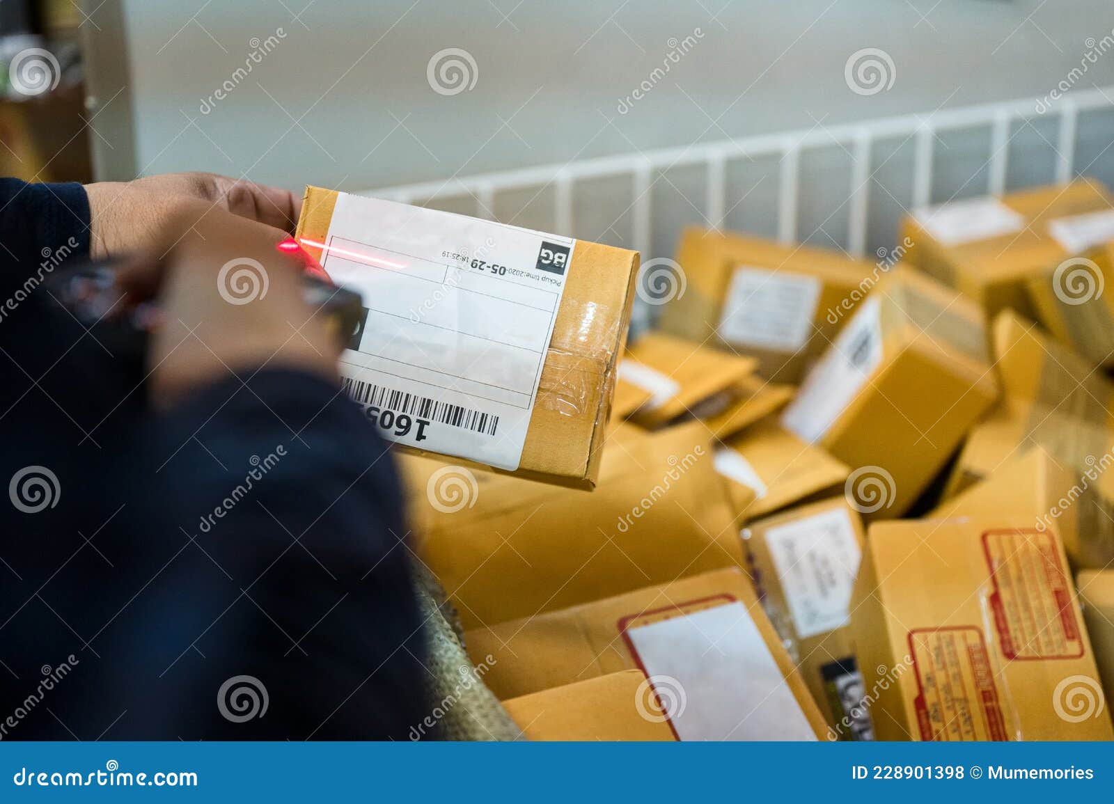 Delivery Man Using Laser Scanner Scanning Parcel Cardboard Box in ...