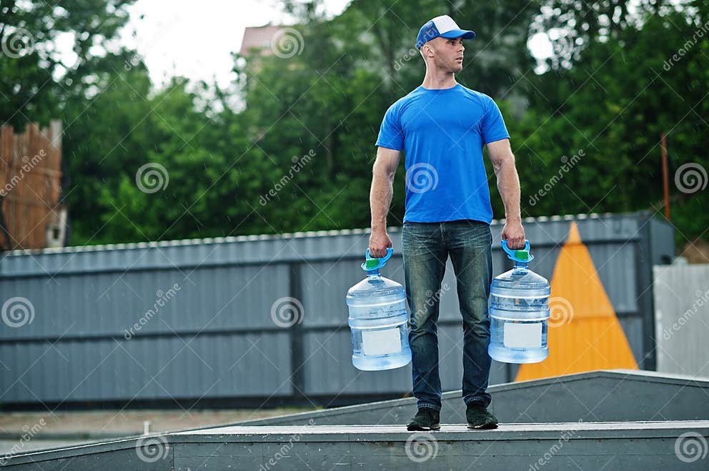 Delivery men of water stock image. Image of office, handling - 211445171