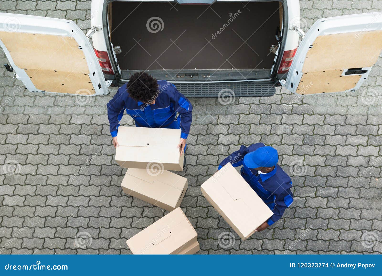 Delivery Men Unloading the Cardboard Boxes Stock Photo - Image of house ...