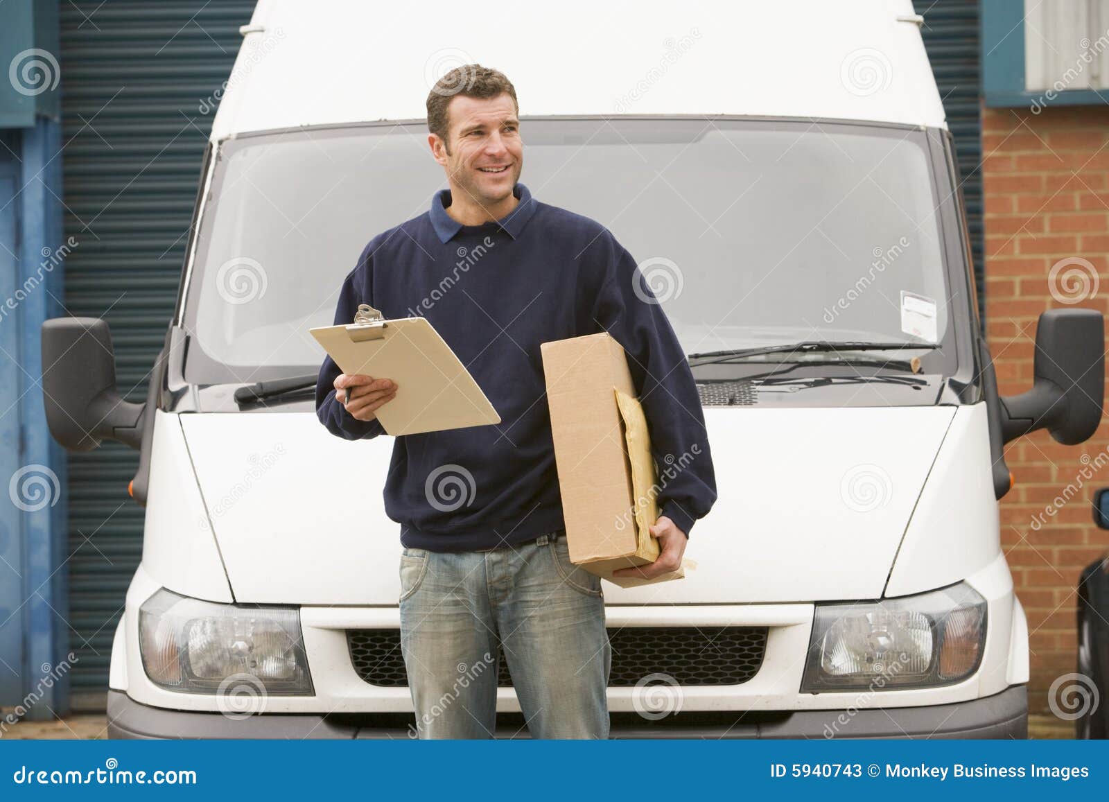 Delivery Person Standing with Parcel and Clipboard Stock Image - Image ...