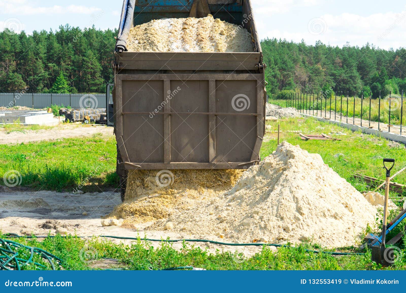 Delivery of Sand for Construction. Dump Truck Unloads the Sand Stock ...