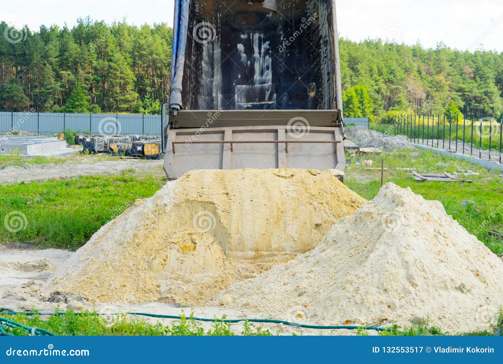 Delivery of Sand for Construction. Dump Truck Unloads the Sand Stock ...