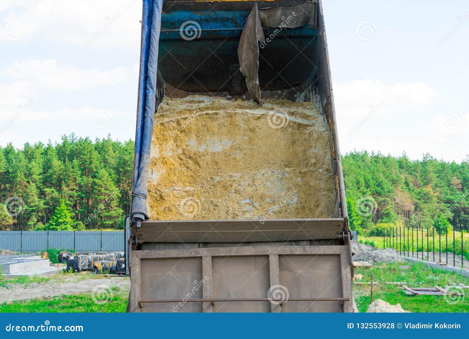 Delivery of Sand for Construction. Dump Truck Unloads the Sand Stock ...