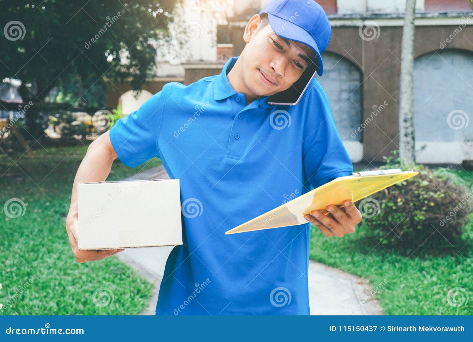 Delivery Service Courier Standing in Front of the House with Box Stock ...