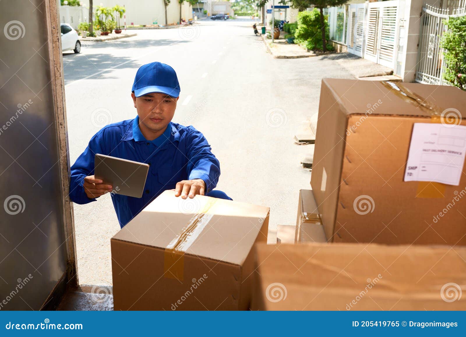 Delivery Service Worker Loading Truck Stock Image - Image of cheerful ...