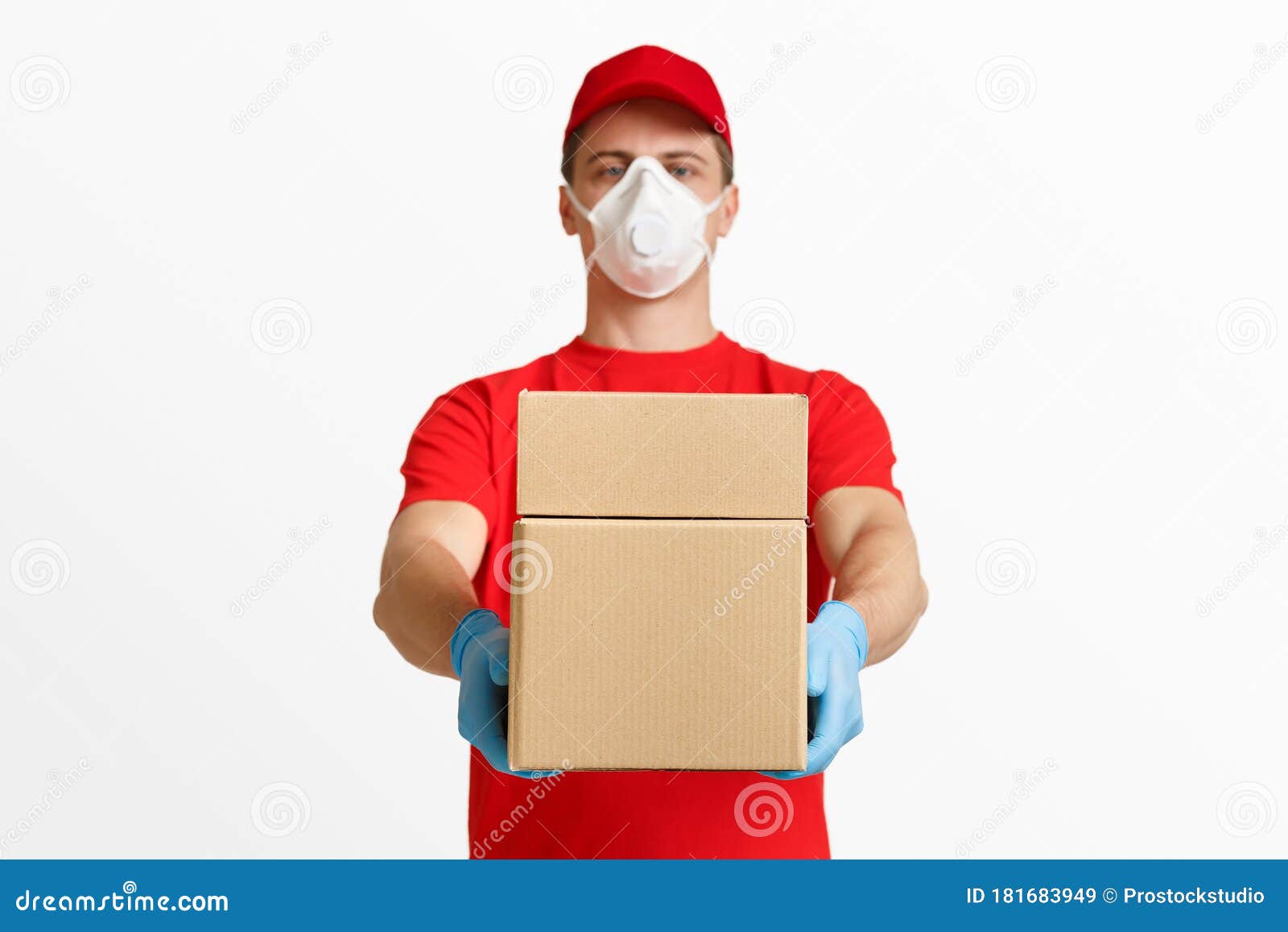 Delivery Services. Courier in Red Uniform Gives Box Stock Image - Image ...