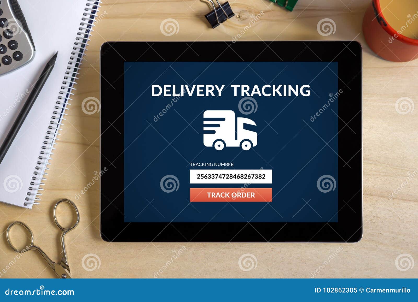 Delivery Tracking Concept on Tablet Screen with Office Objects Stock ...