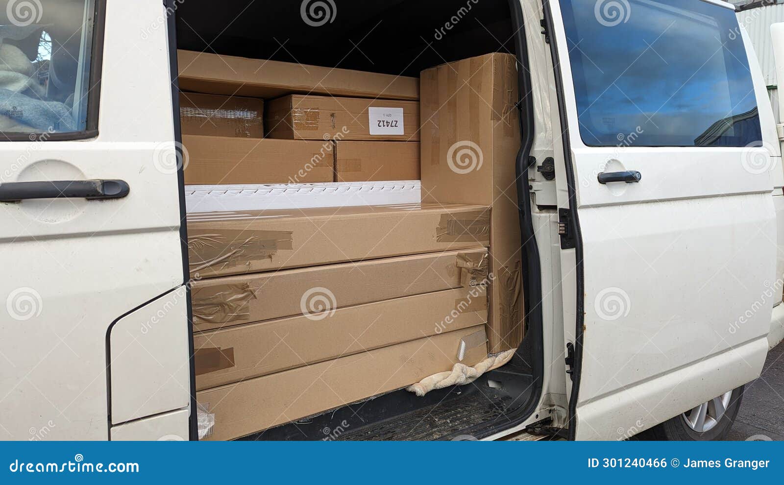 A Delivery Van Packed with Parcels and Boxes Ready for Delivery Stock ...