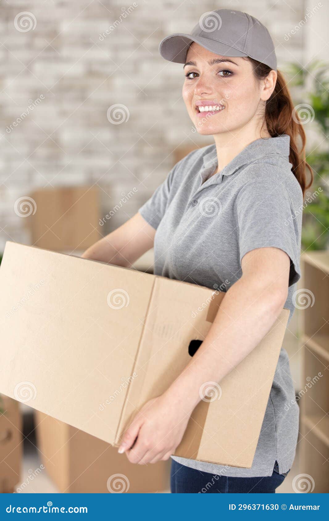 Delivery Woman Carrying Cardboard Box Stock Photo - Image of uniform ...