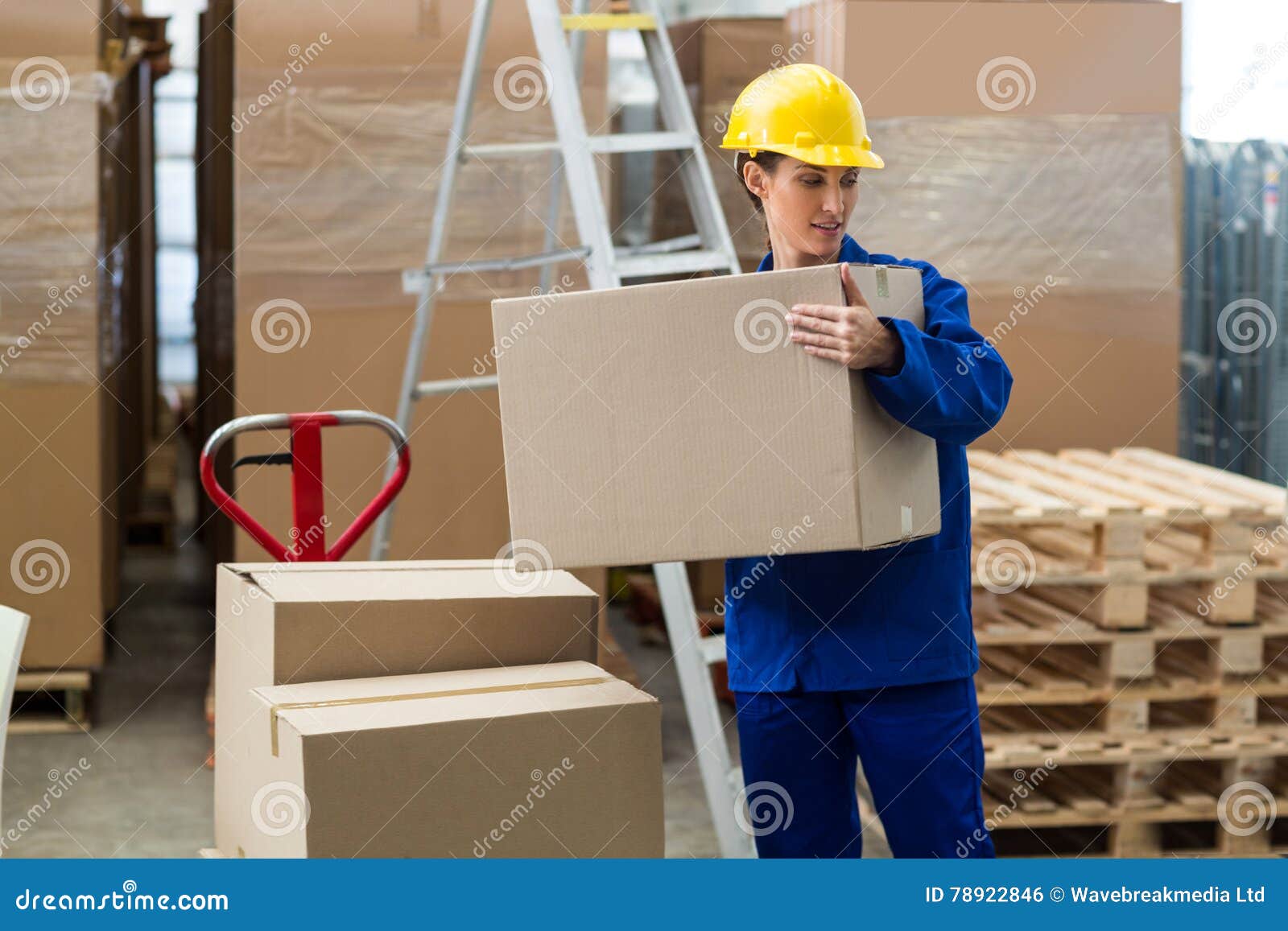 Delivery Worker Unloading Cardboard Boxes from Pallet Jack Stock Photo ...