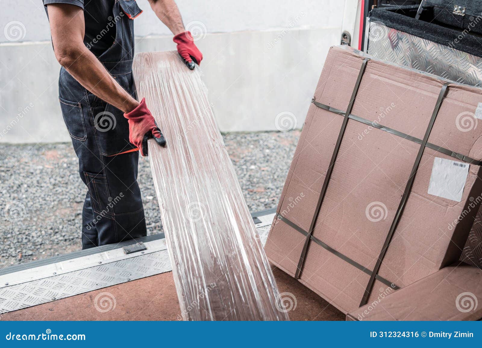 Delivery Worker Unloading Packages from Cargo Vehicle Efficiently Stock ...