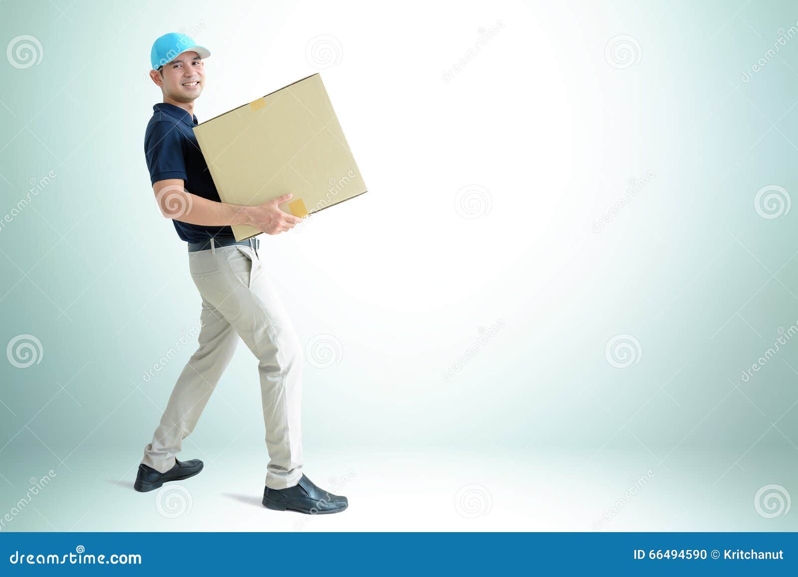Deliveryman Carrying a Cardboard Parcel Box Stock Photo - Image of ...