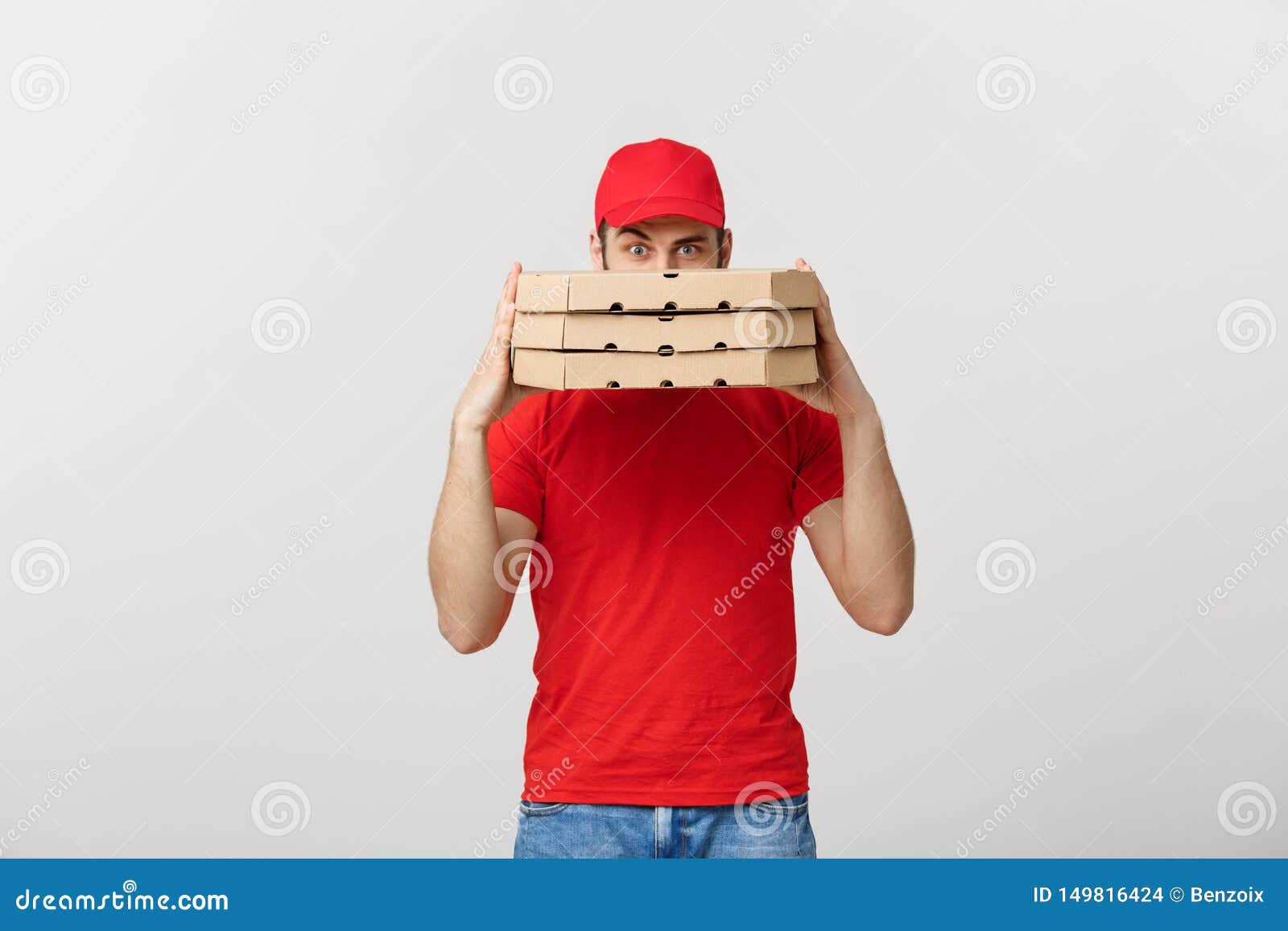 A Deliveryman Hidden Behind a Large Stack of Pizza Boxes he is Carrying ...