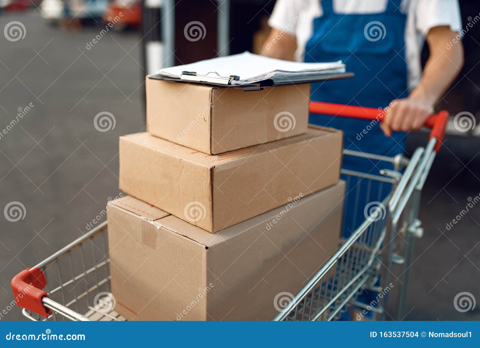 Deliveryman Holds Cart with Stack of Boxes Stock Photo - Image of ...