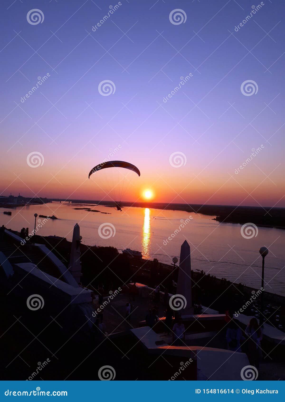 Delta Glider Flying Over the River Volga at Sunset Stock Photo - Image ...