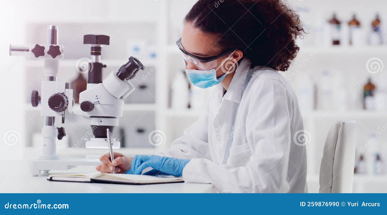 Delving into New Scientific Research. a Young Scientist Writing Notes ...