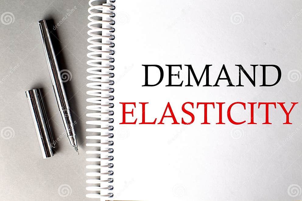 DEMAND ELASTICITY Text on a Notebook with Pen on Grey Background Stock ...