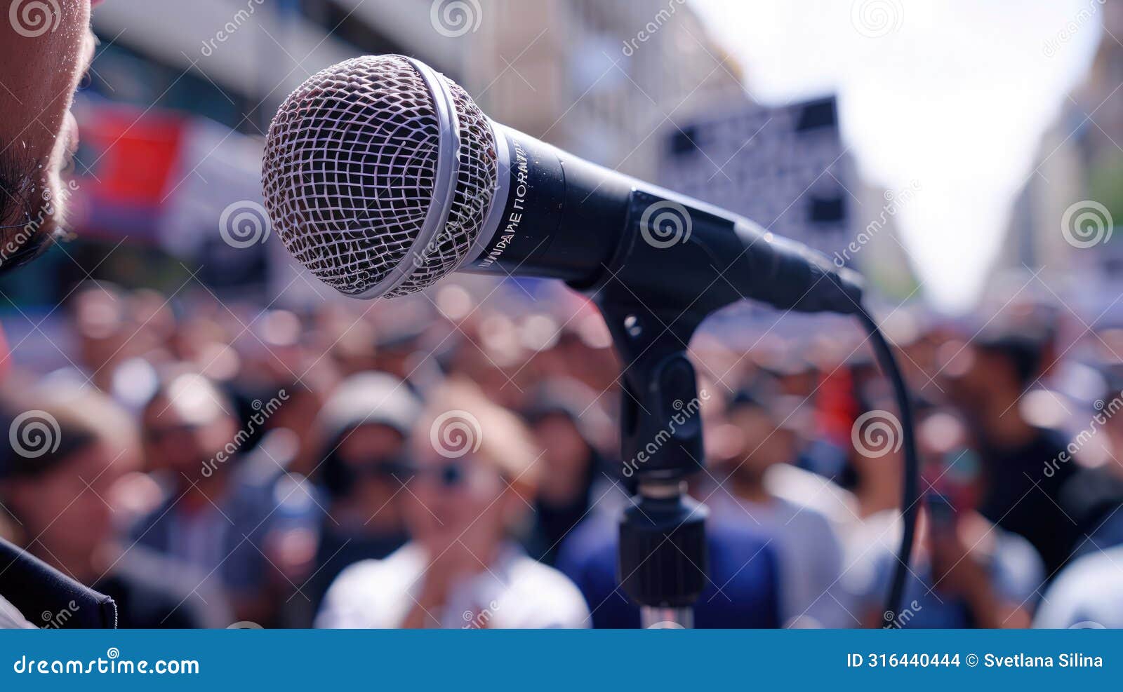 Democracy Day Rally Captured: Speaker at the Forefront, Symbolizing ...