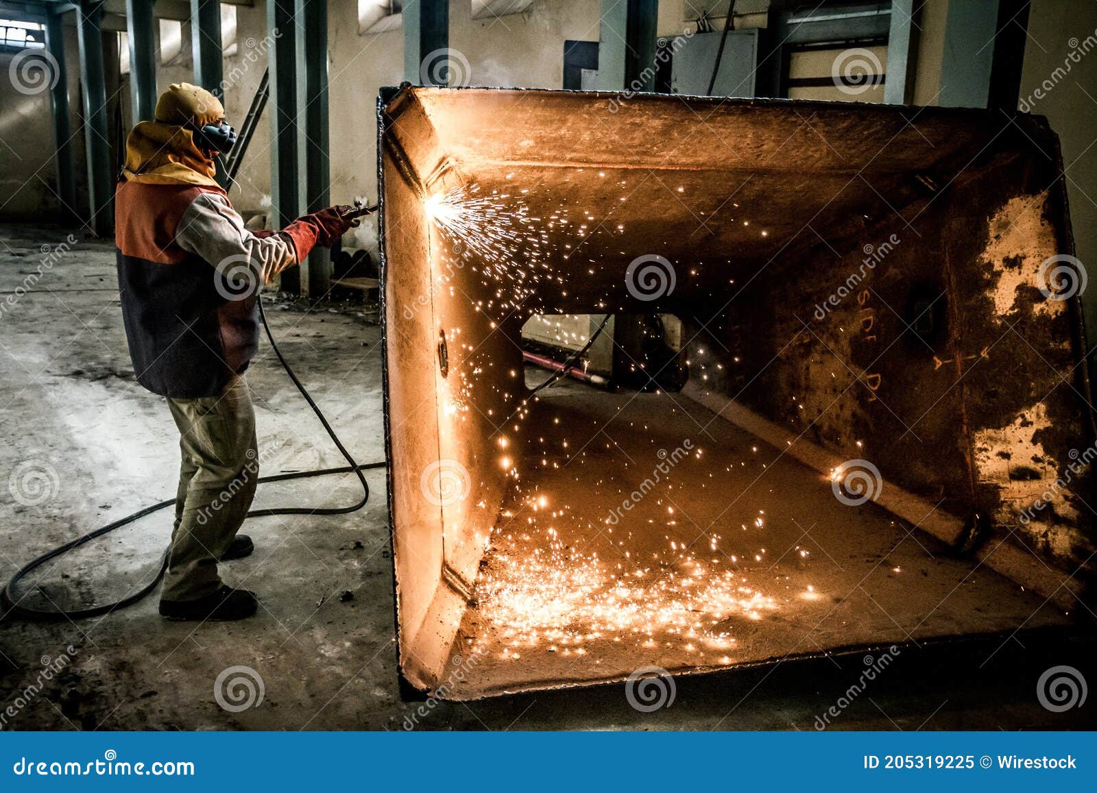 Demolition Construction Worker Using a Flame Torch To Cut Up Heavy ...