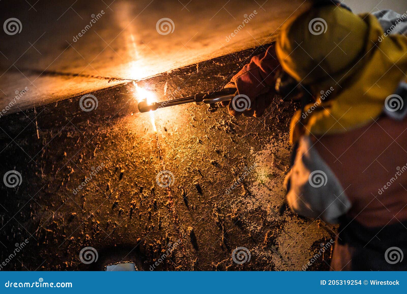 Demolition Construction Worker Using a Flame Torch To Cut Up Heavy ...
